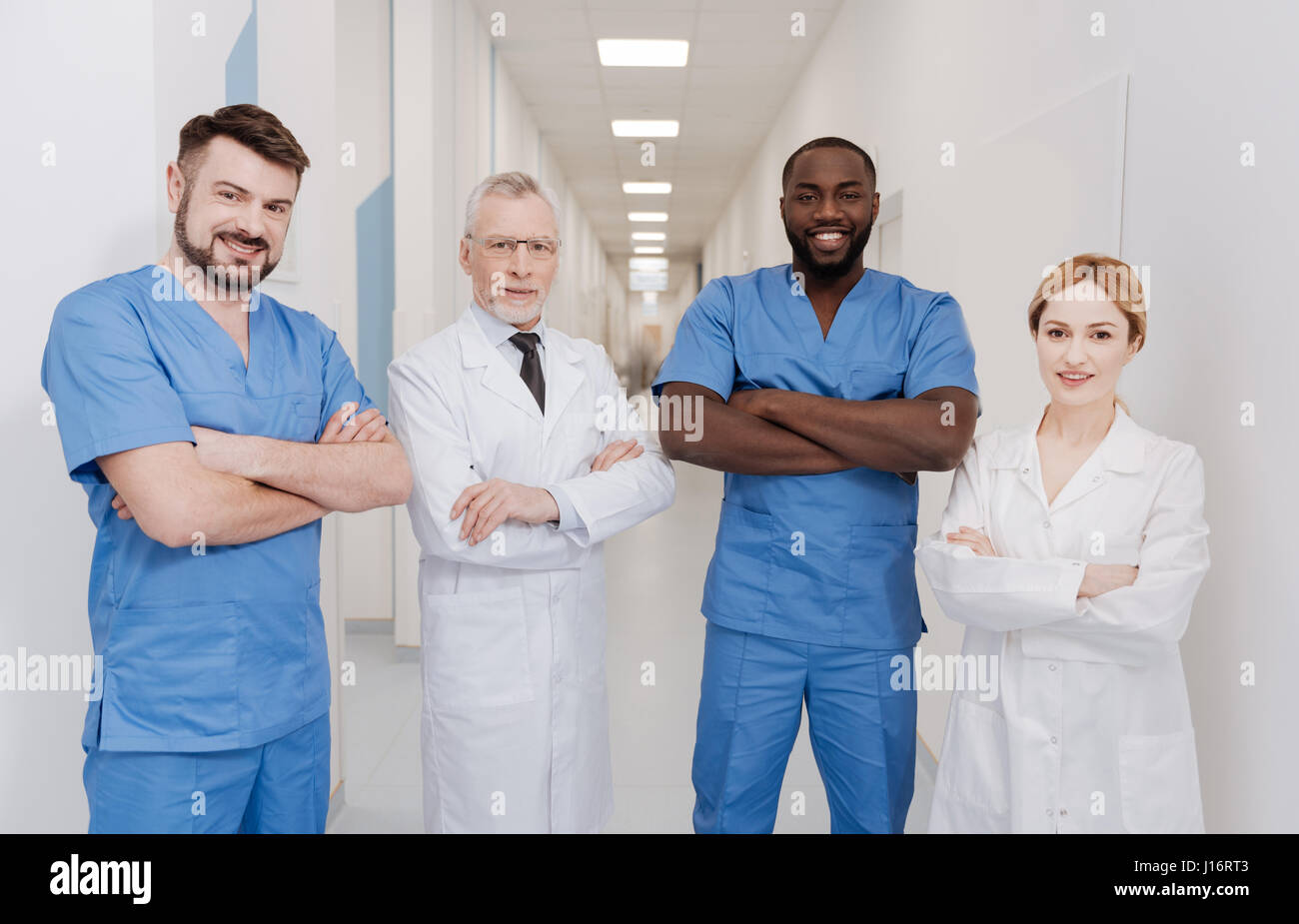 Happy colleagues expressing happiness in the hospital Stock Photo - Alamy