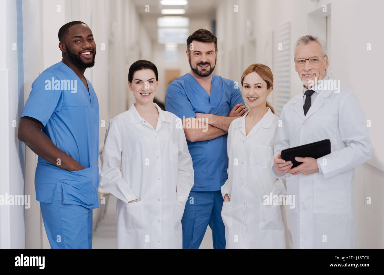 Cheerful medical team working in cooperation in the hospital Stock ...