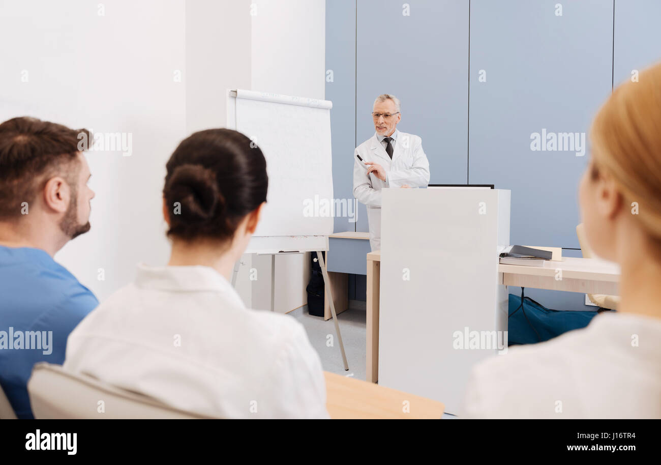 Qualified professor giving a lecture in the medical college Stock Photo ...
