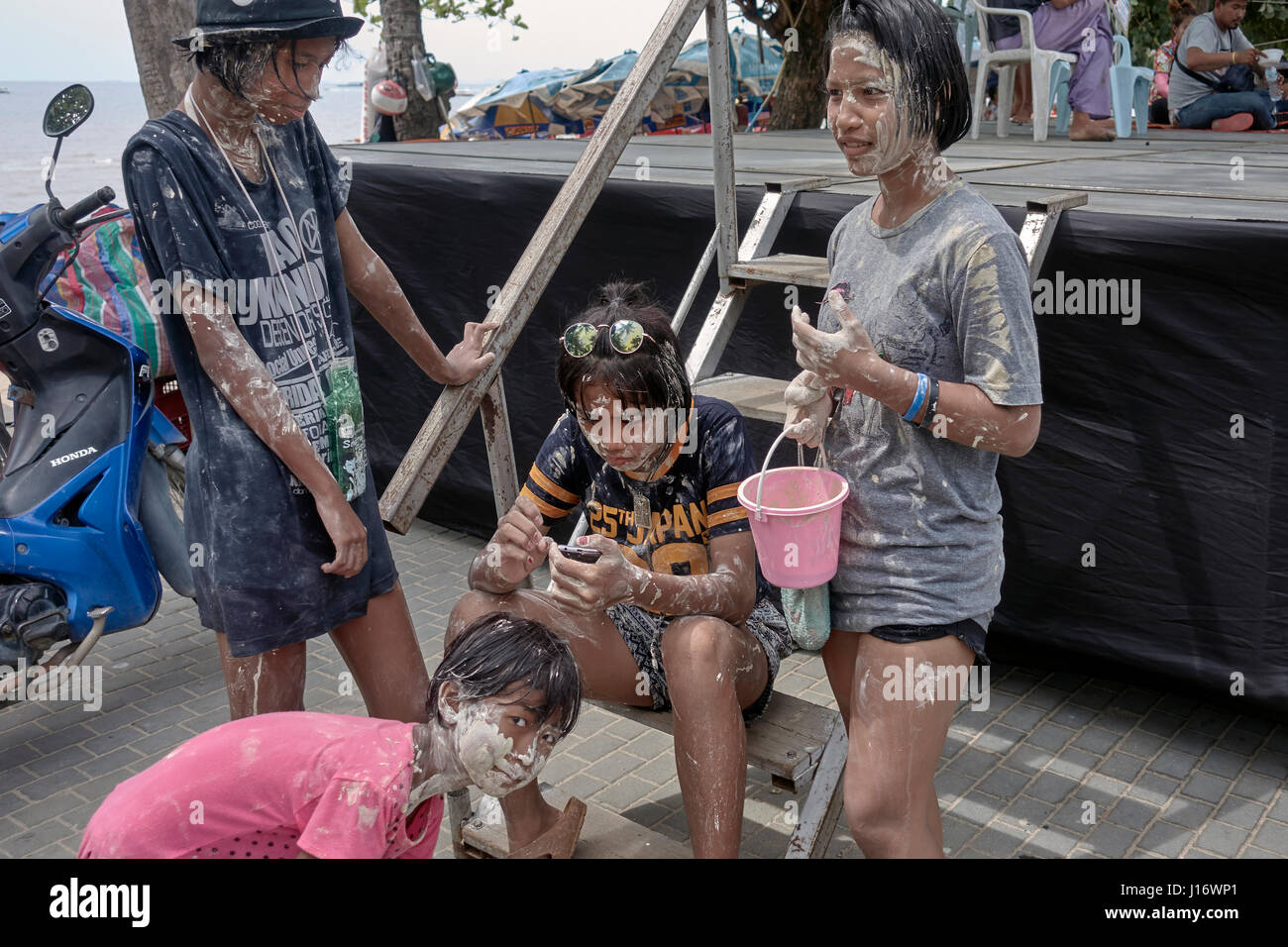 Songkran. Thai kids at the Songkran water celebrations covered in white ...