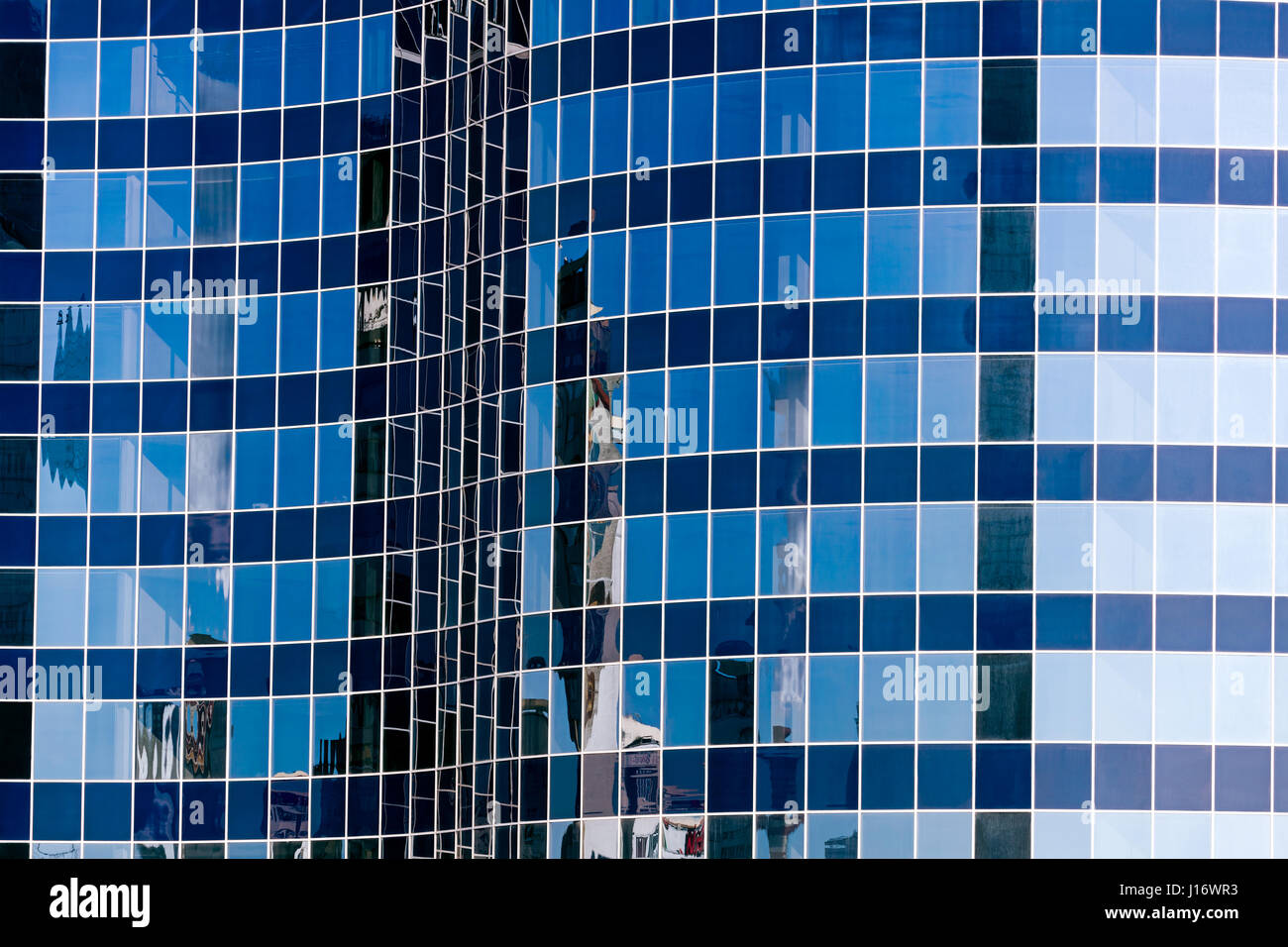 glass windows of modern office building with sky reflections Stock ...