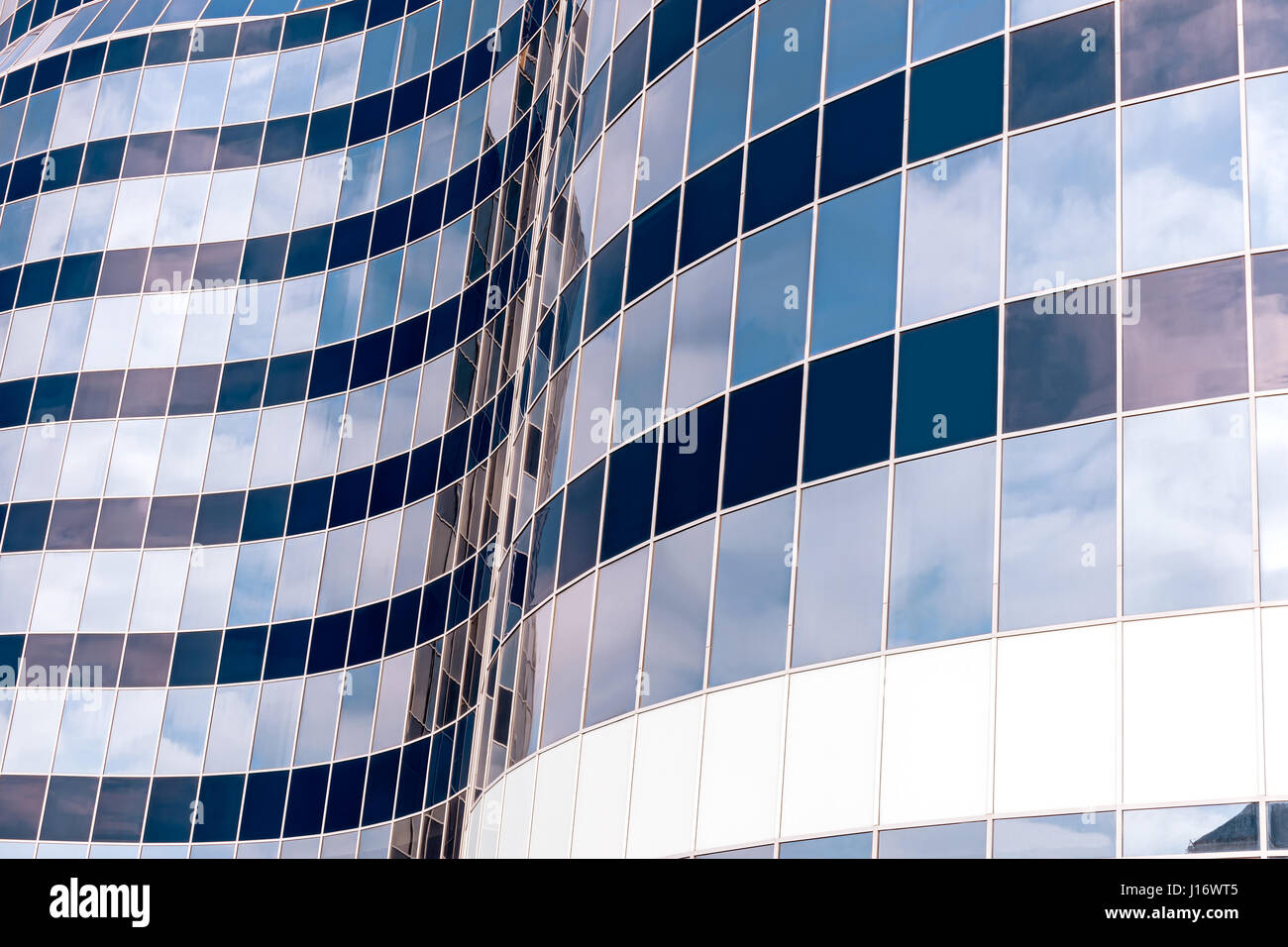 modern blue glass wall of skyscraper with clouds reflection Stock Photo ...