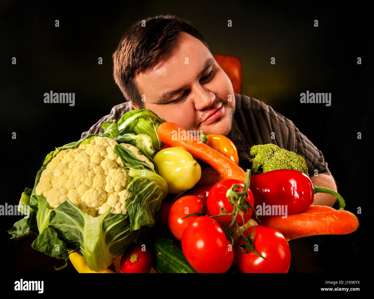 Diet fat man eating healthy food . Healthy breakfast with vegetables ...