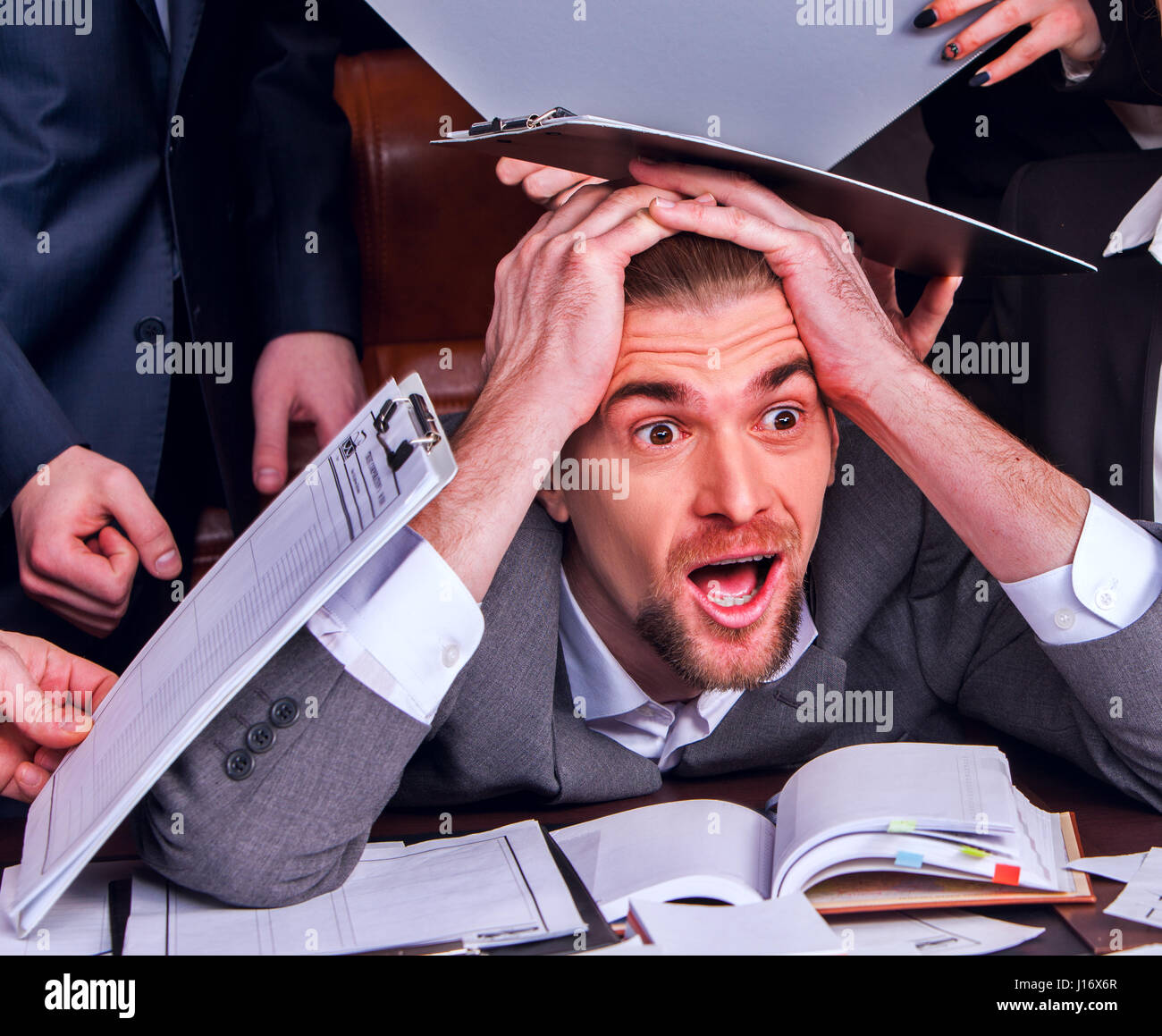 Business man in office.People are unhappy with their leader Stock Photo ...