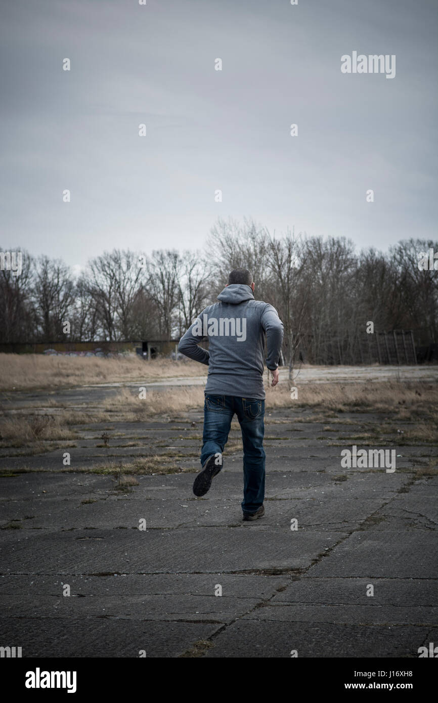 Man Running Away Danger High Resolution Stock Photography and Images ...
