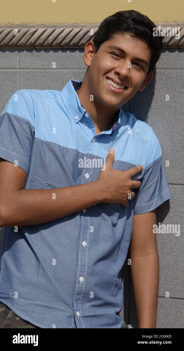 Male Teen With Hand Over Heart Stock Photo - Alamy