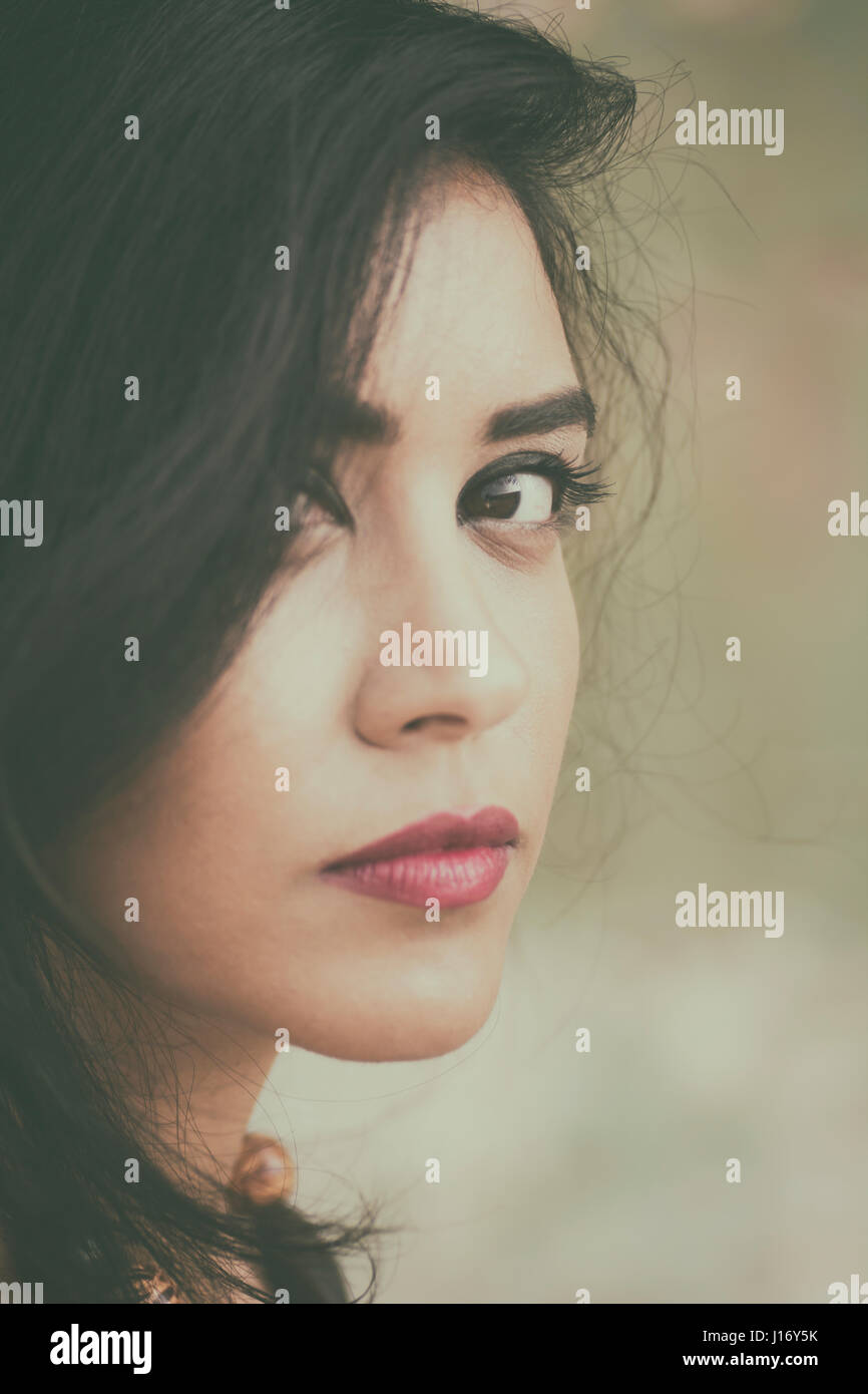 Beautiful young woman staring Stock Photo - Alamy