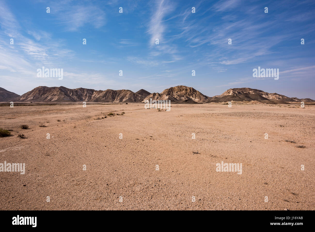 Wide panorama of Ras Al Jinz desert and arid mountains, Sultanate of ...