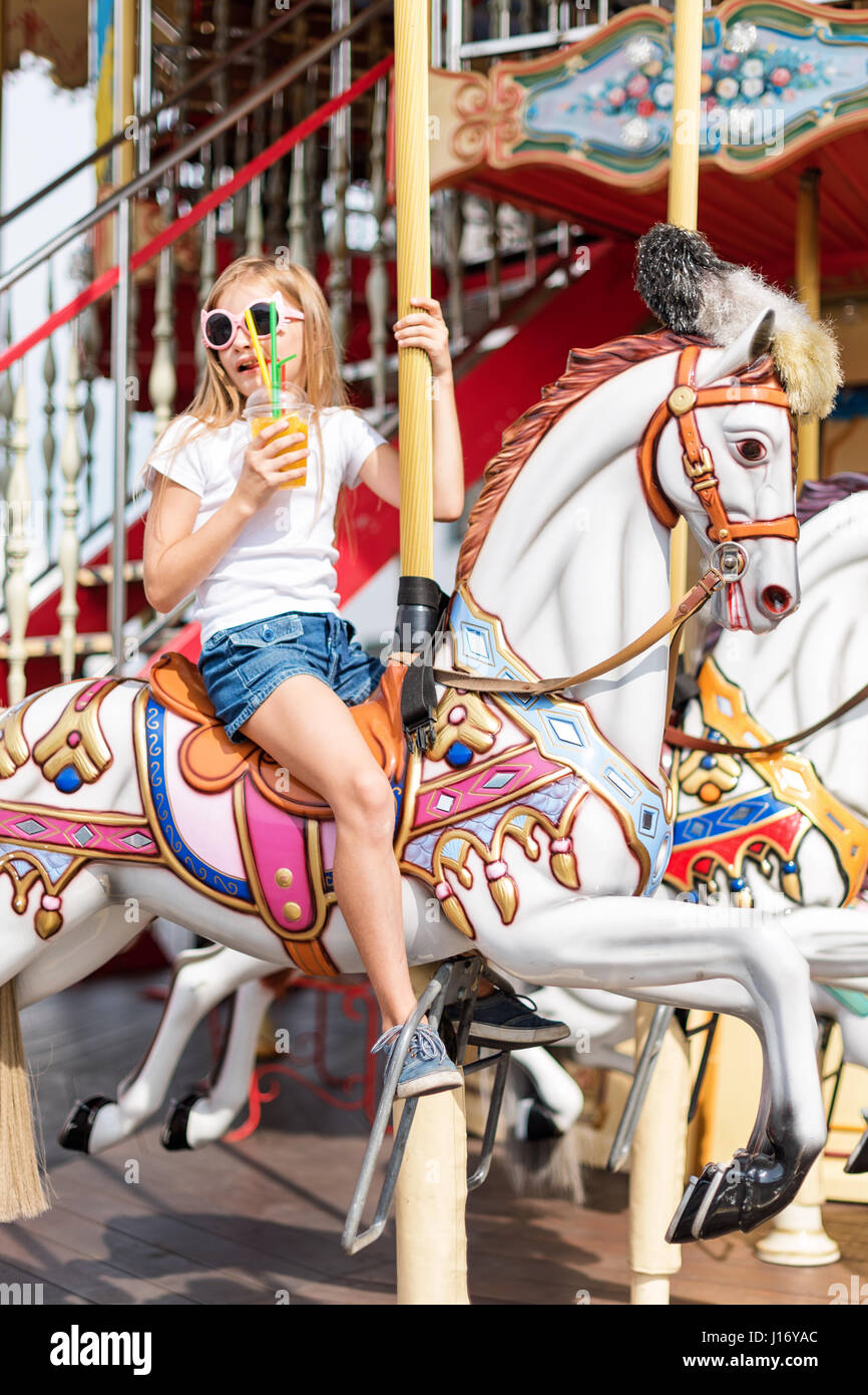 Girl Riding On Merry Go Round High Resolution Stock Photography and ...