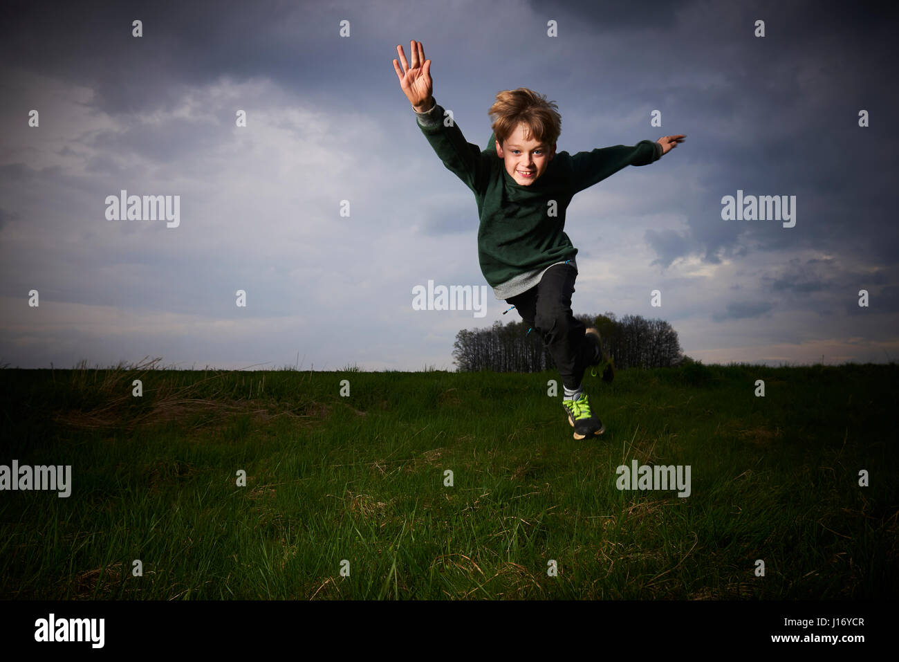 Child kid jumping outdoor grass jump hi-res stock photography and ...