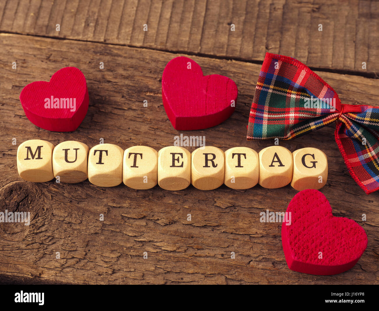 Mothers Day background with the German word Mothersday on wooden dices ...