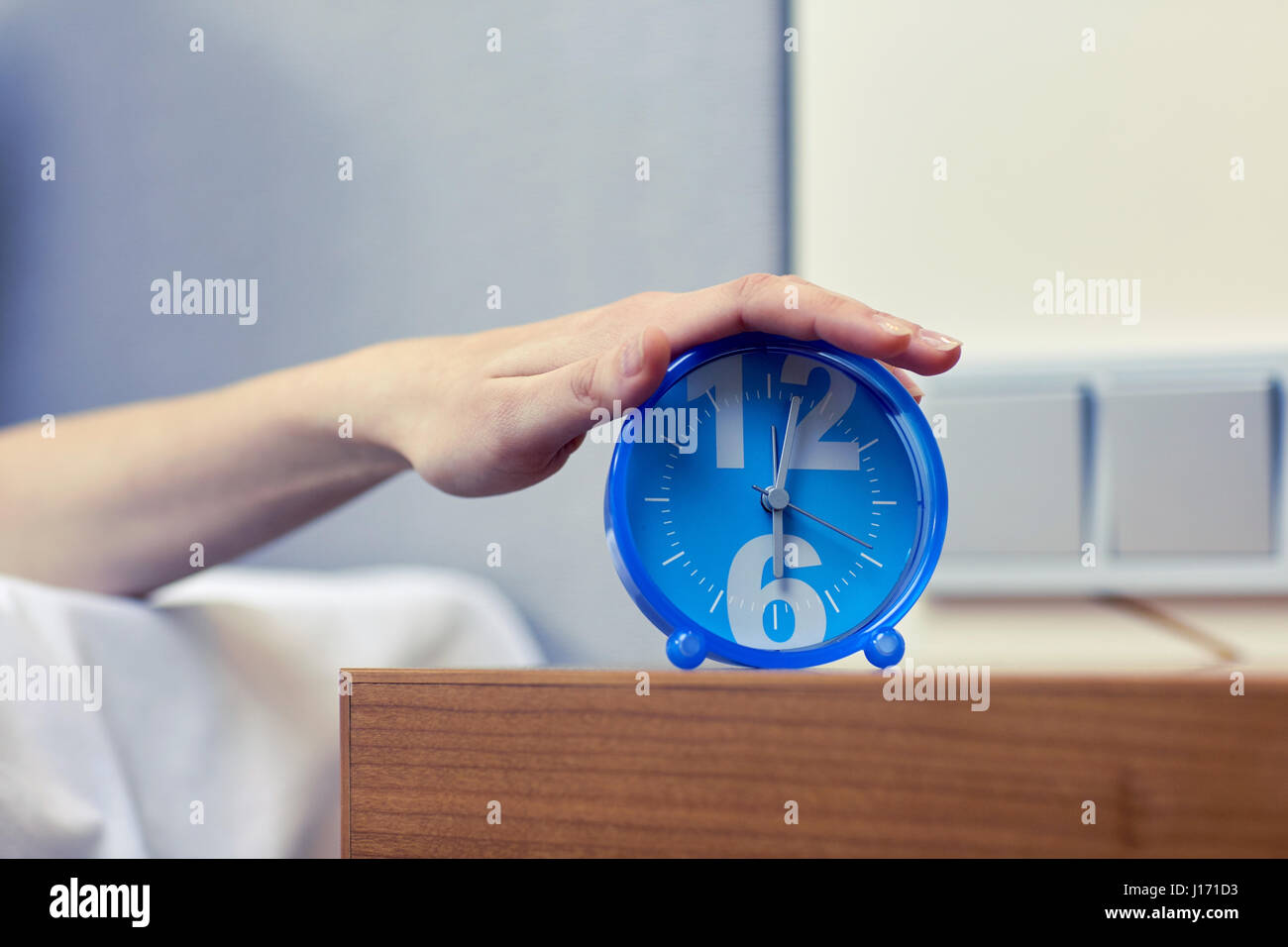 Arm reaching for alarm clock hi-res stock photography and images - Alamy