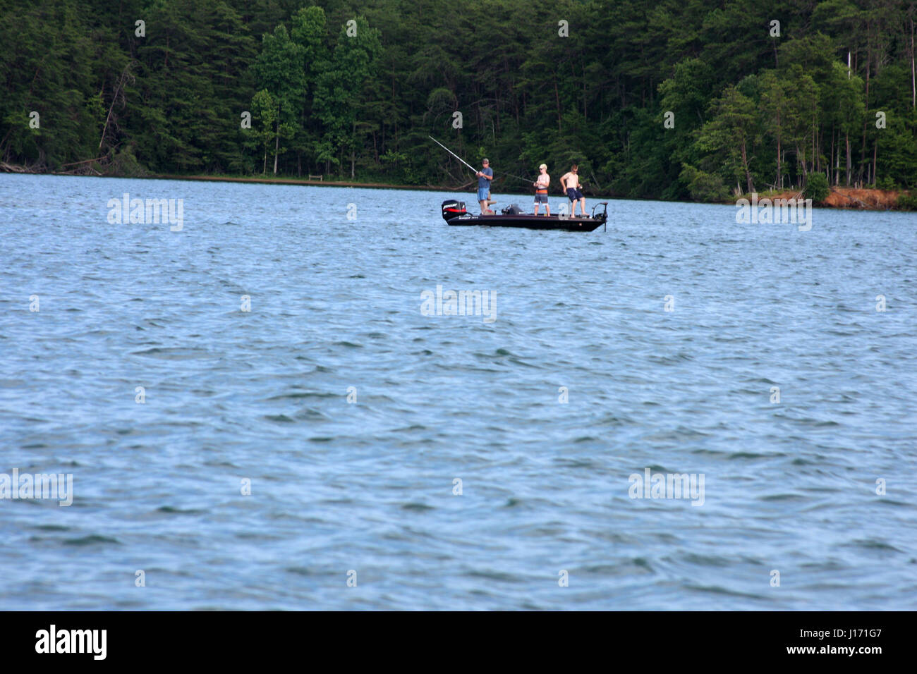 Fishing from a boat Stock Photo - Alamy