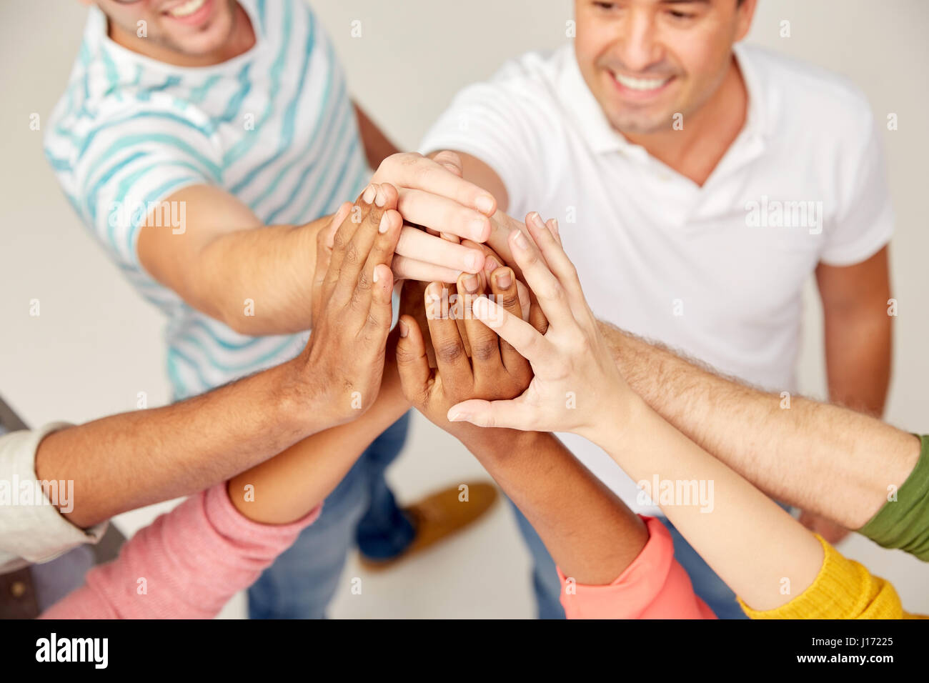 international group of people making high five Stock Photo - Alamy