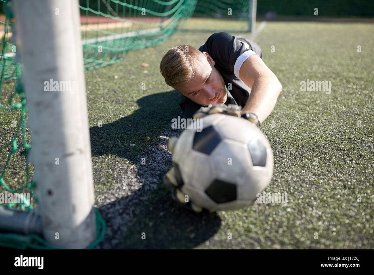 Goal keeper catching ball hi-res stock photography and images - Alamy