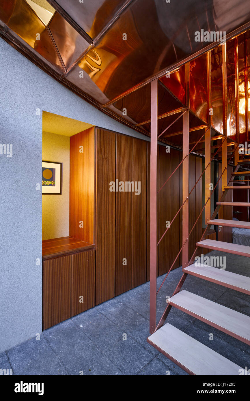 Interior view of corridor showing timber panelling and stairs. K House ...