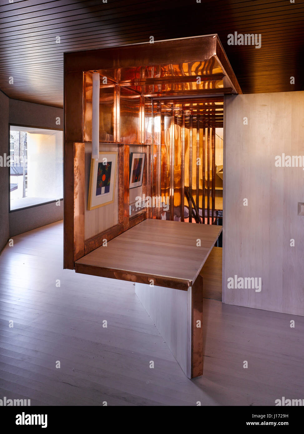 Interior view of copper staircase enclosure showing counter and door. K ...