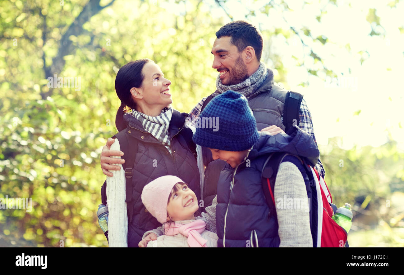 happy family with backpacks hiking Stock Photo - Alamy