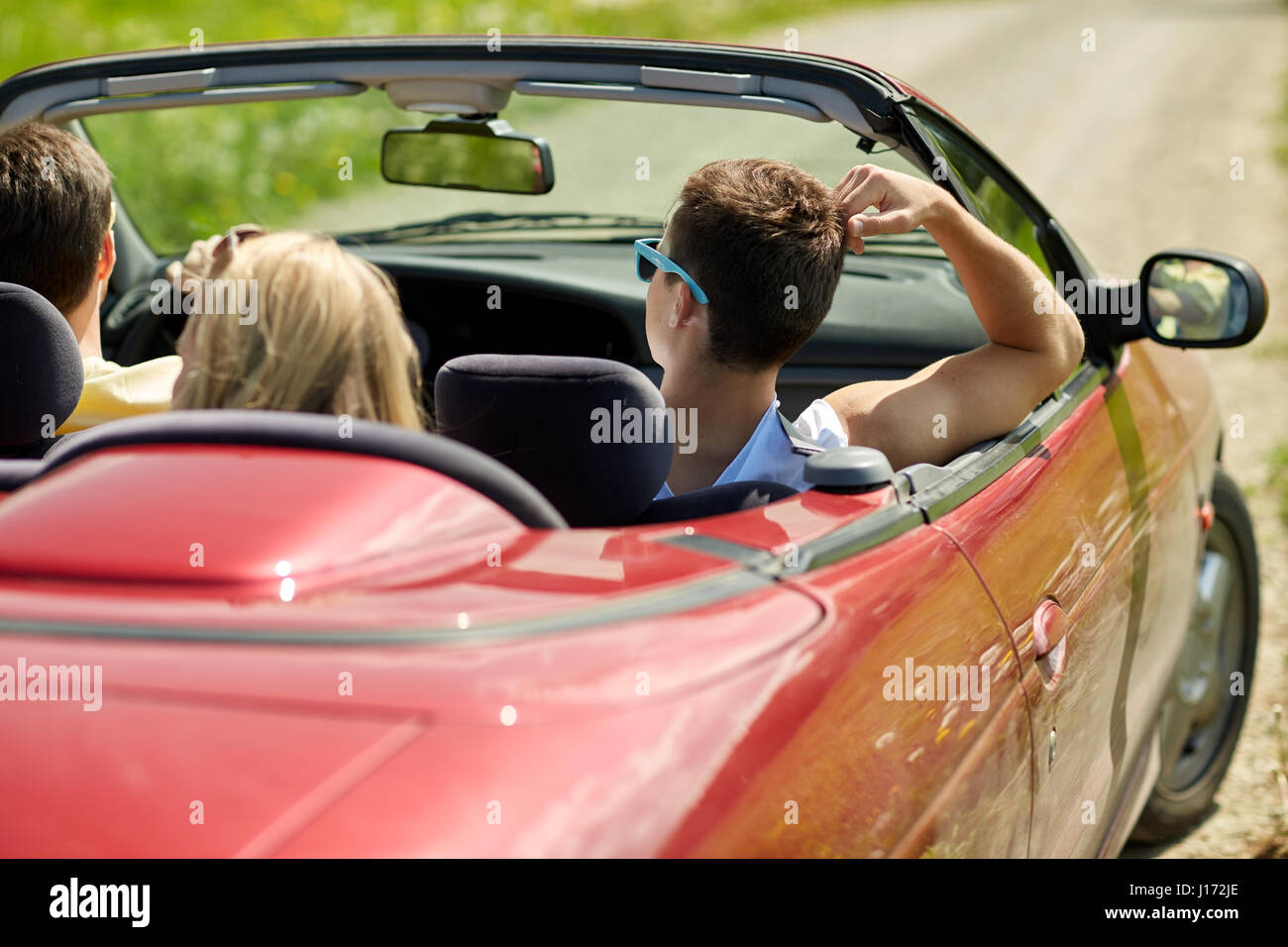 happy friends driving in convertible car at summer Stock Photo - Alamy