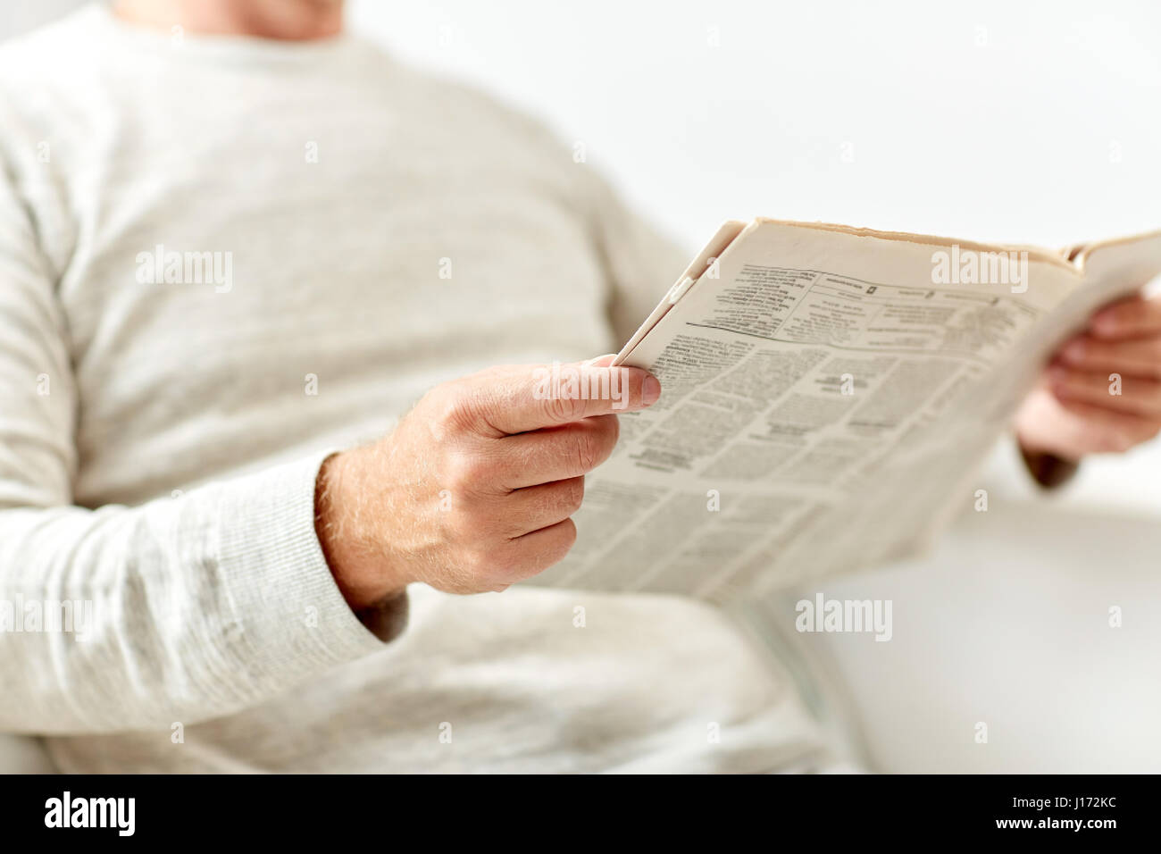 Close up man reading article hi-res stock photography and images - Alamy