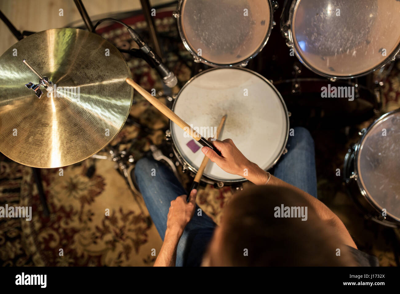 male musician playing drums and cymbals at concert Stock Photo - Alamy