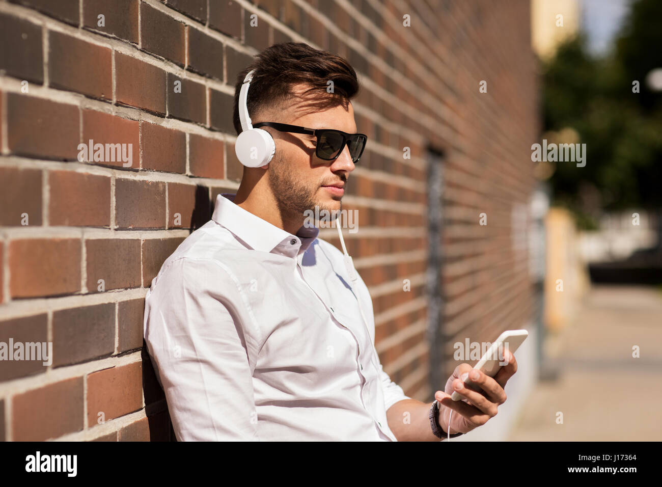 man with headphones and smartphone listening music Stock Photo - Alamy