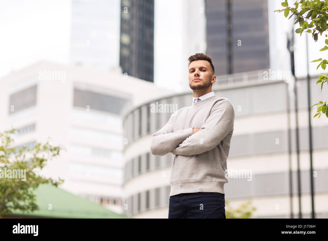 young man on city street Stock Photo - Alamy