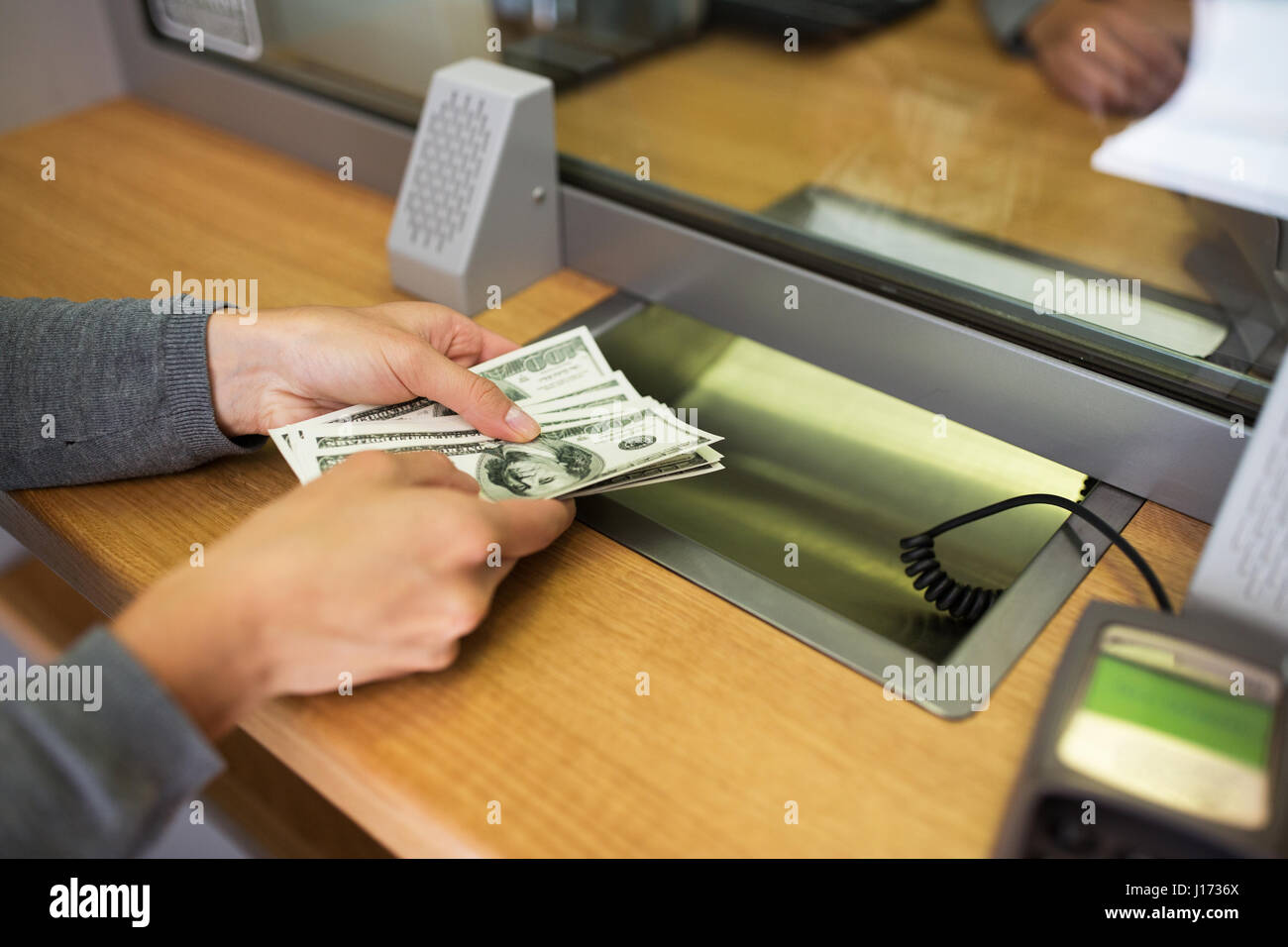 hands with money at bank or currency exchanger Stock Photo - Alamy