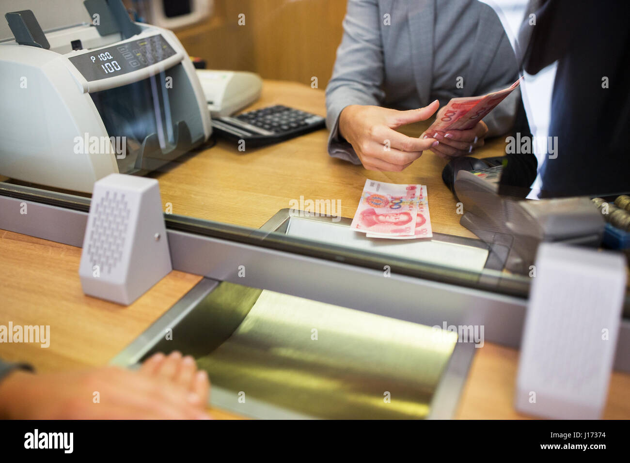 clerk counting cash money at bank office Stock Photo - Alamy