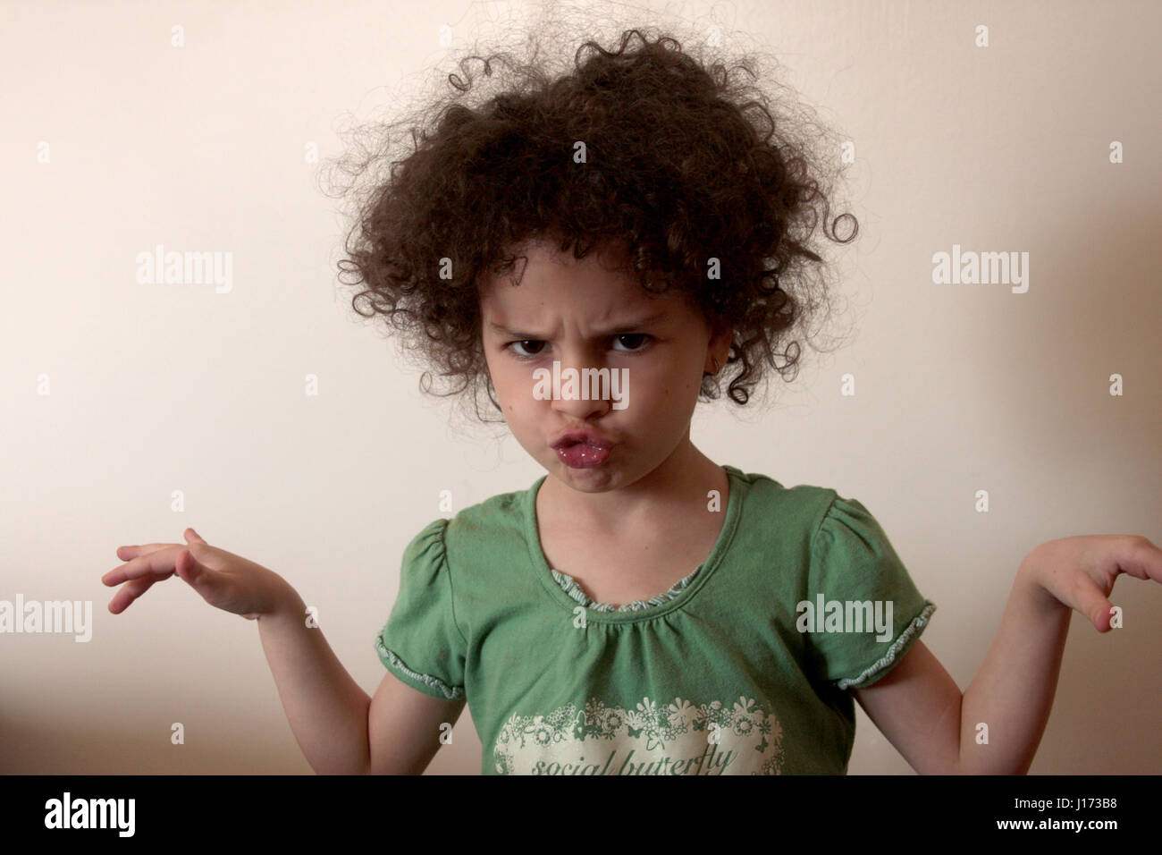 Cute little girl with upset expression Stock Photo - Alamy