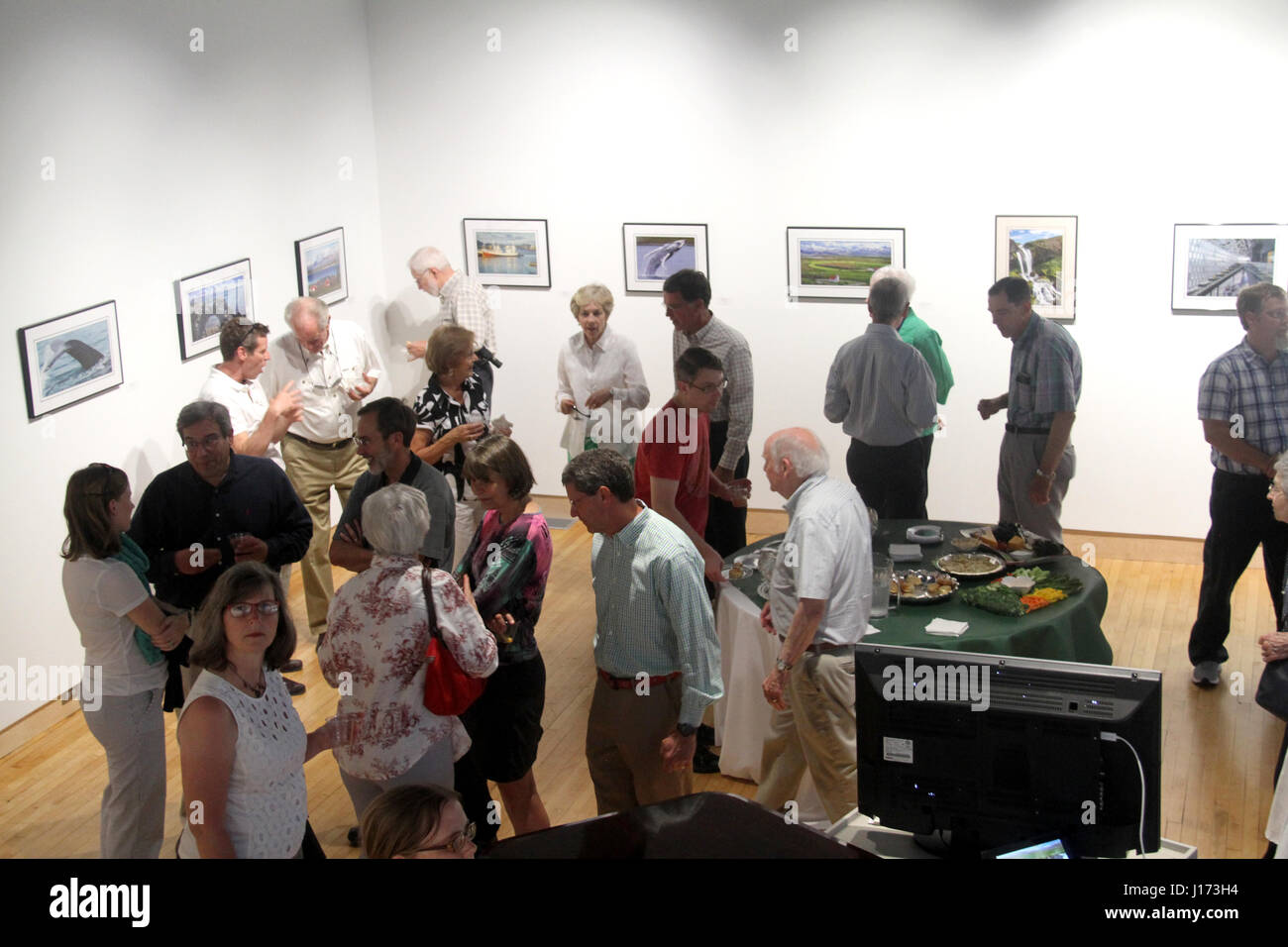 People gathered for opening reception of art exhibit Stock Photo - Alamy