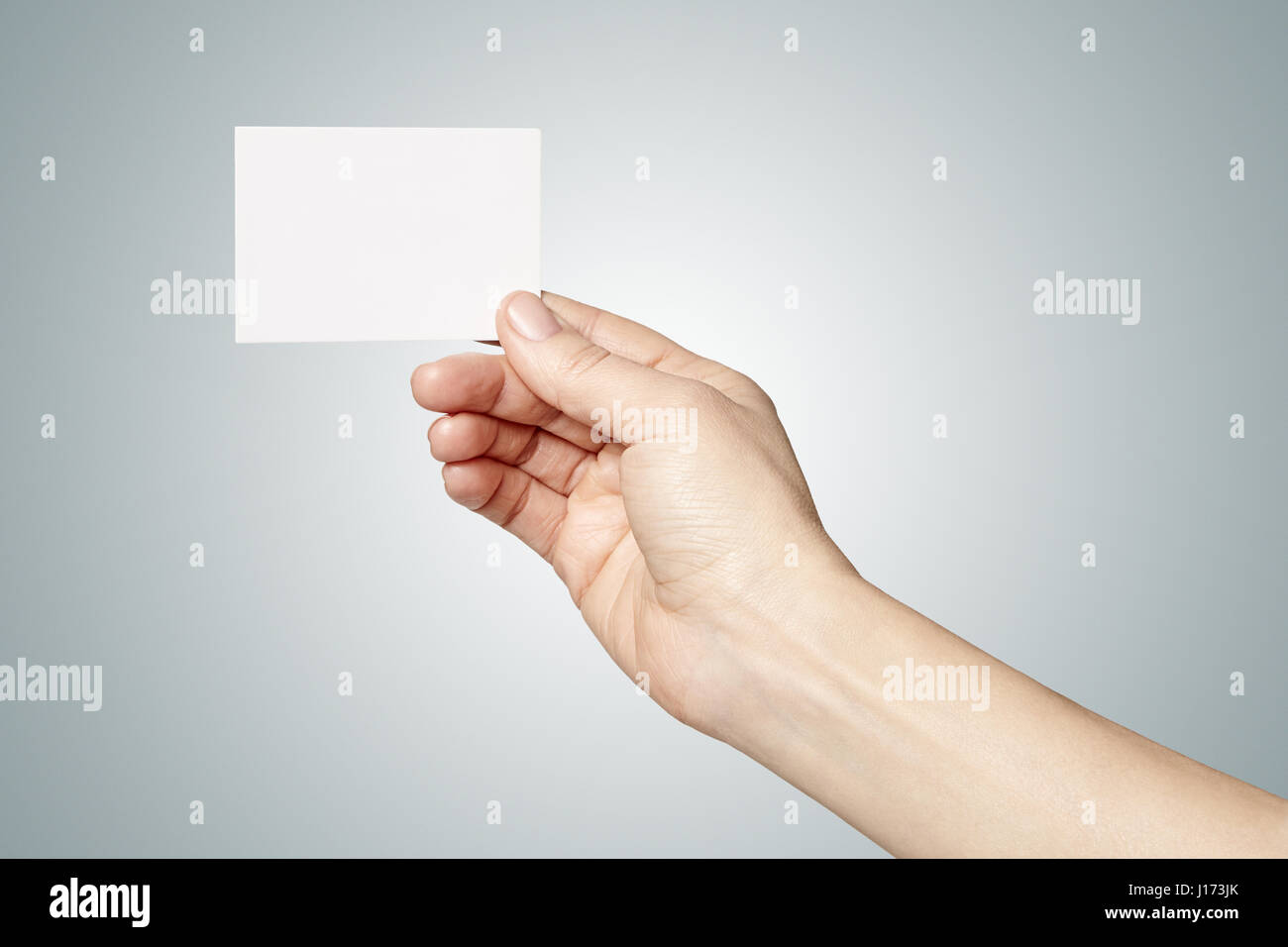 Woman hand holding a card Stock Photo - Alamy