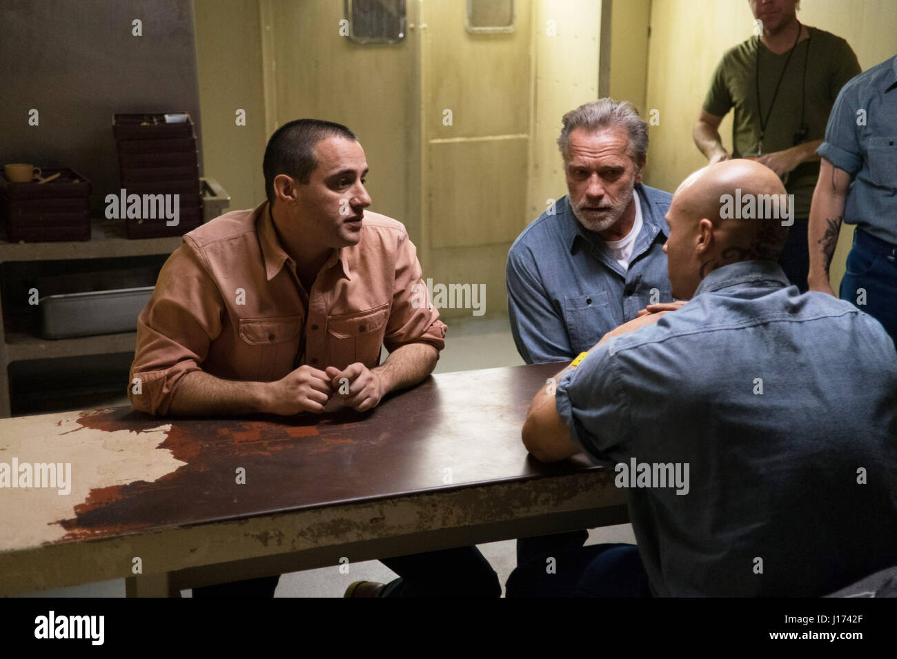 AFTERMATH, director Elliott Lester (left), Arnold Schwarzenegger (beard ...