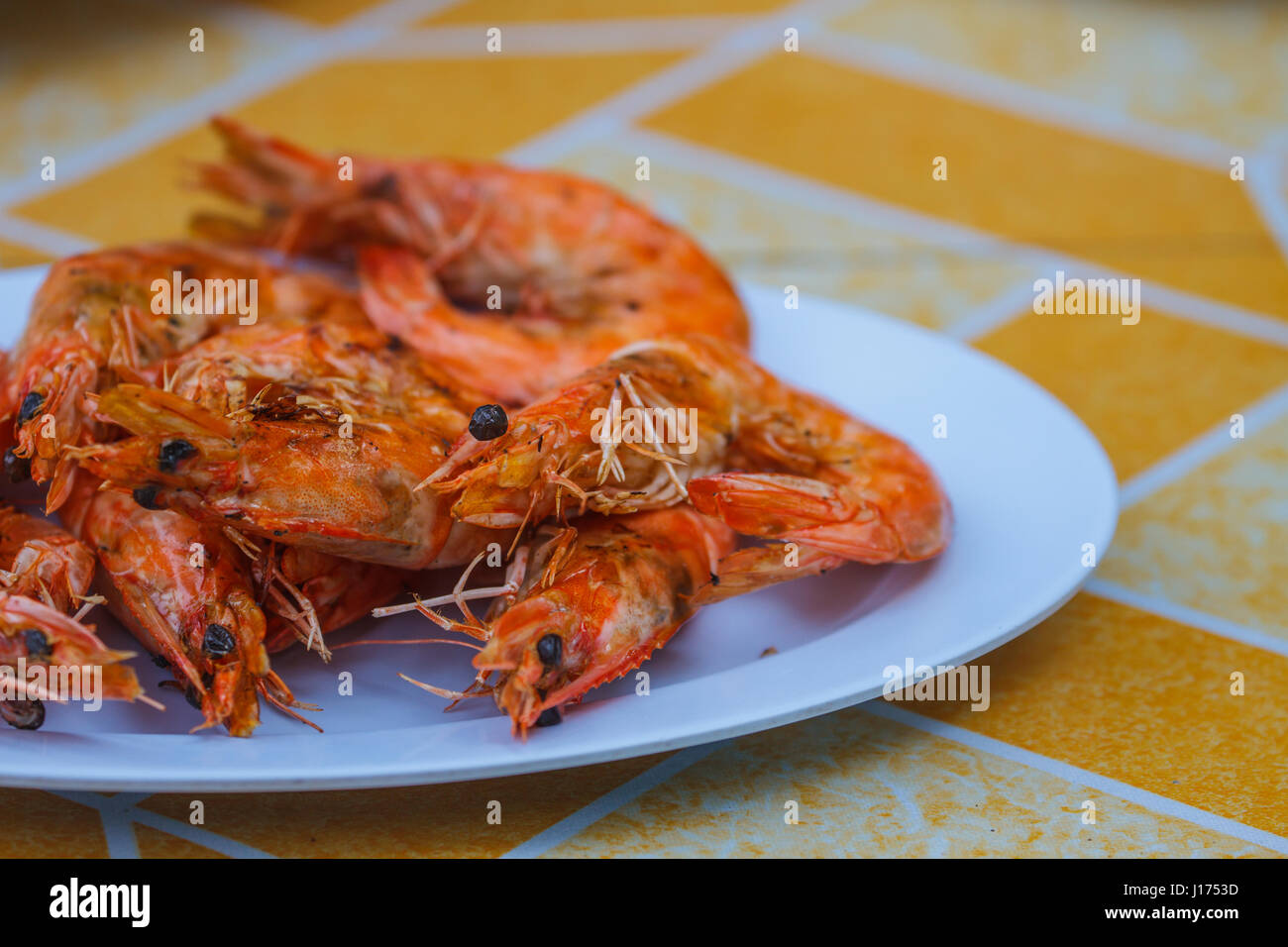 Grilled prawns on plate, delicious prawns on thw table Stock Photo - Alamy