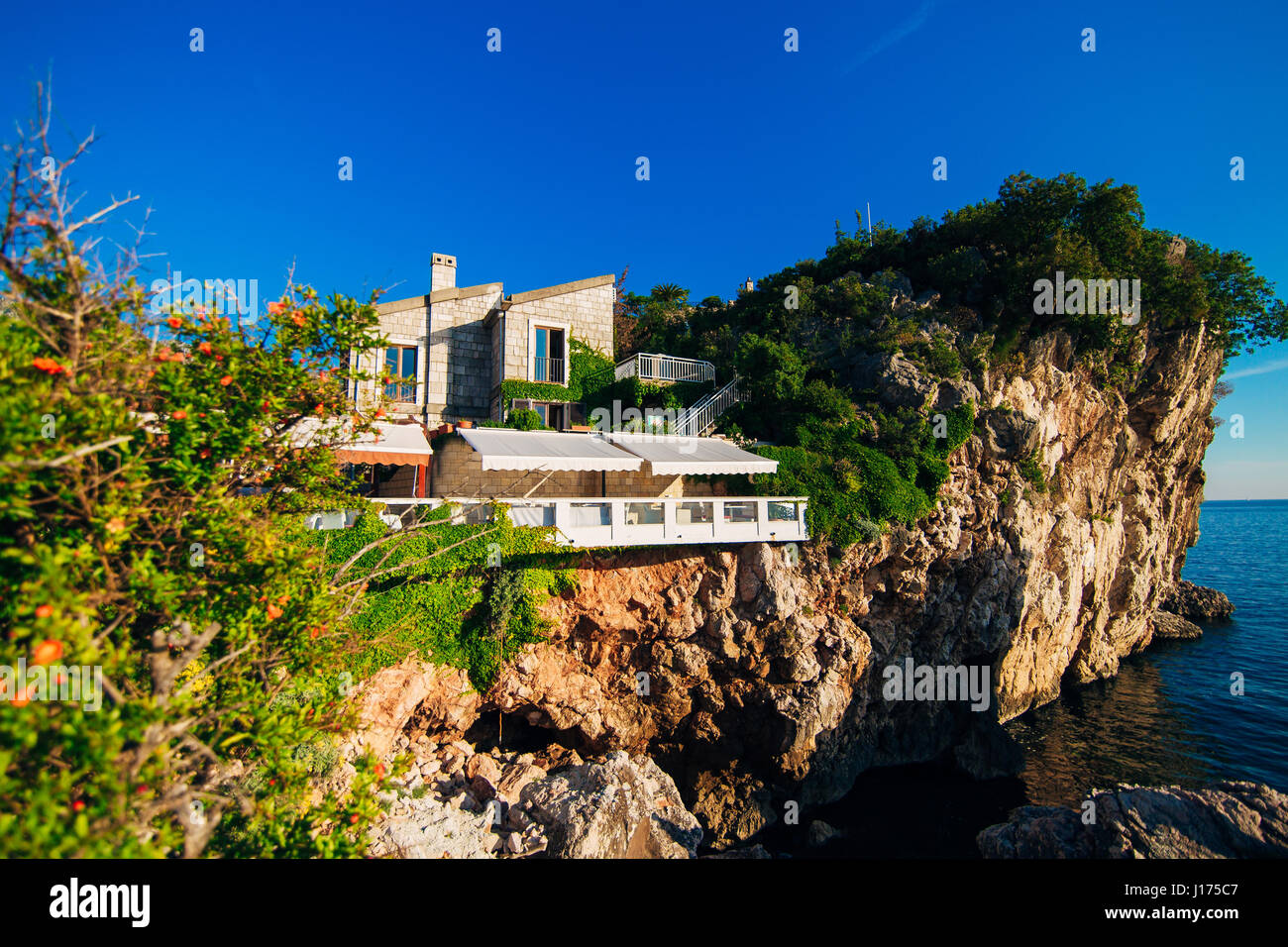 Restaurant on a rock, on a cliff above the sea Stock Photo - Alamy