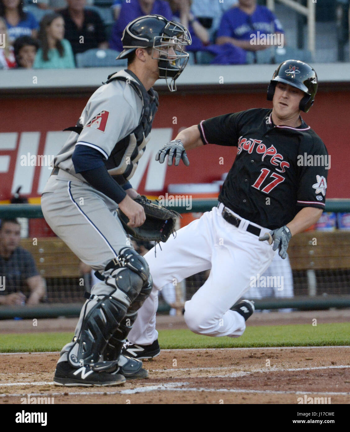 Usa. 18th Apr, 2017. SPORTS -- The Isotope's Zach Jemiola slides into ...