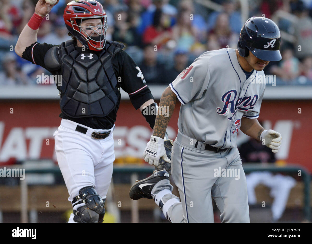 Usa. 18th Apr, 2017. SPORTS -- Isotopes catcher Ryan Hanigan throws out ...