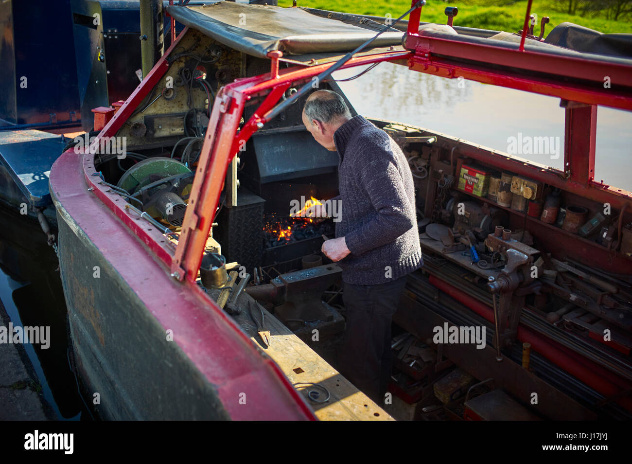 Brian Greaves blacksmith on a canal boat Stock Photo - Alamy