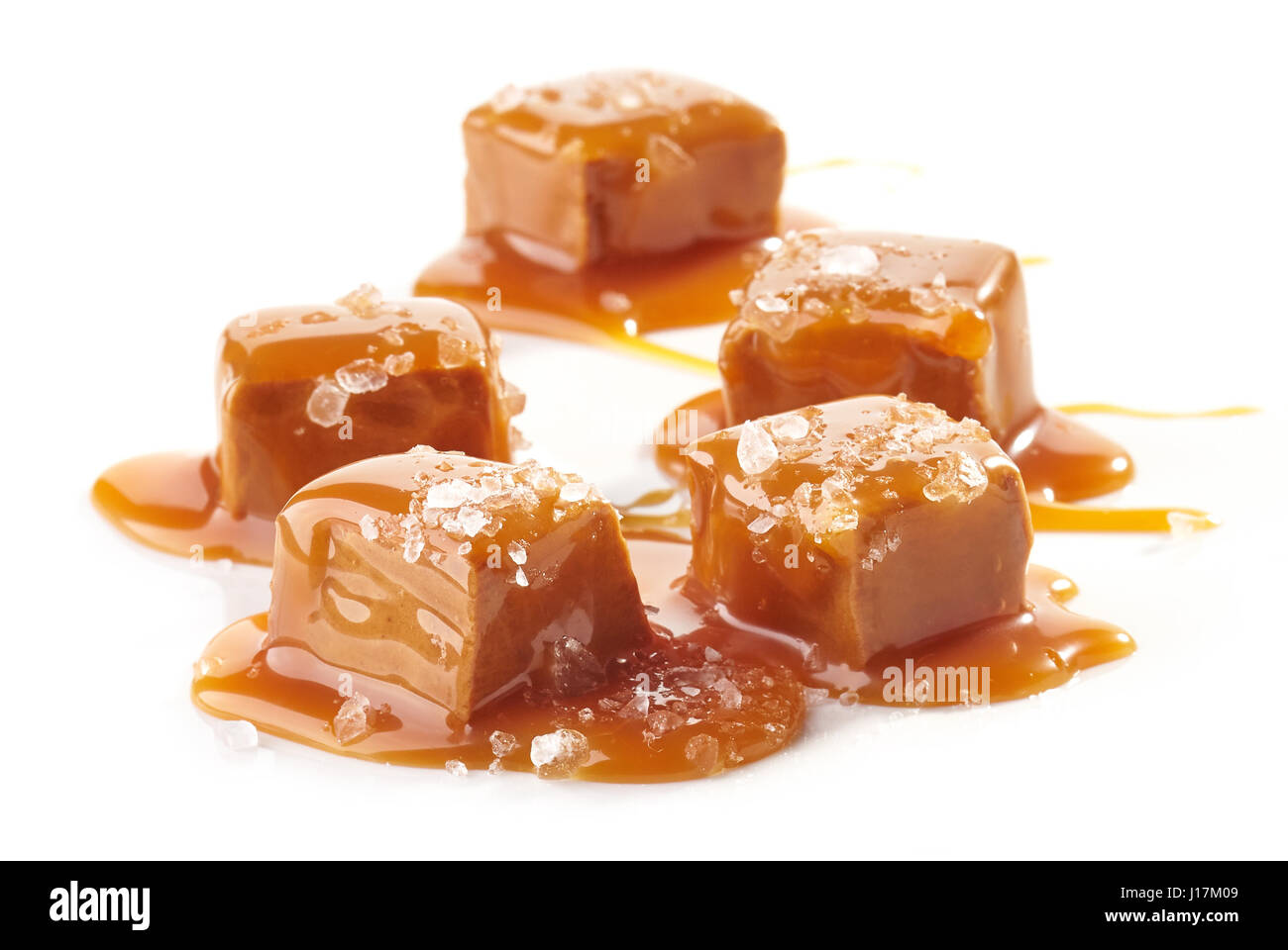 homemade salted caramel pieces isolated on white background Stock Photo ...