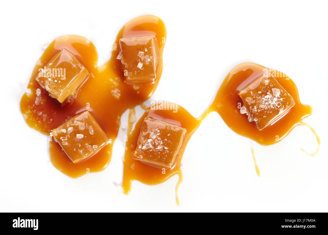 homemade salted caramel pieces isolated on white background, top view ...