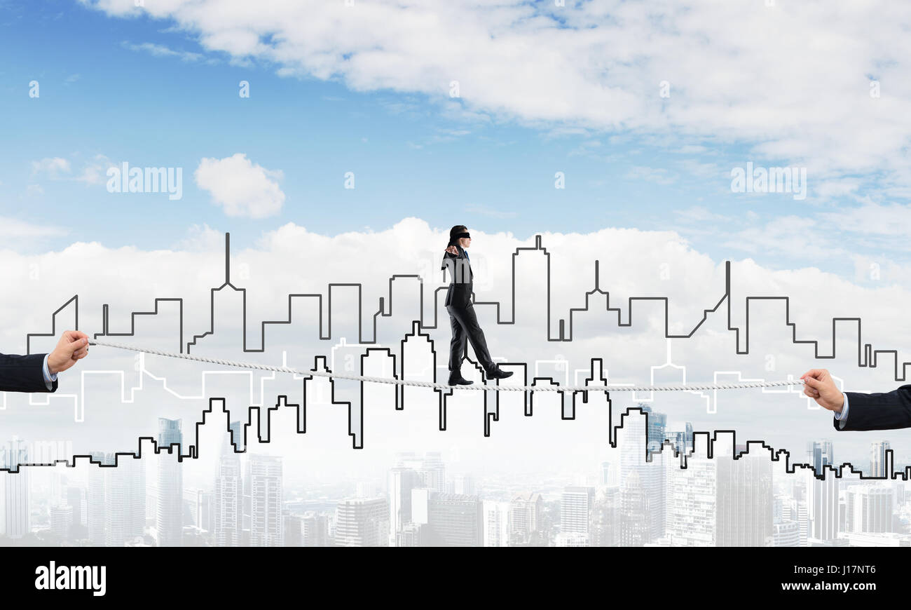 Business concept of risk support and assistance with man balancing on ...
