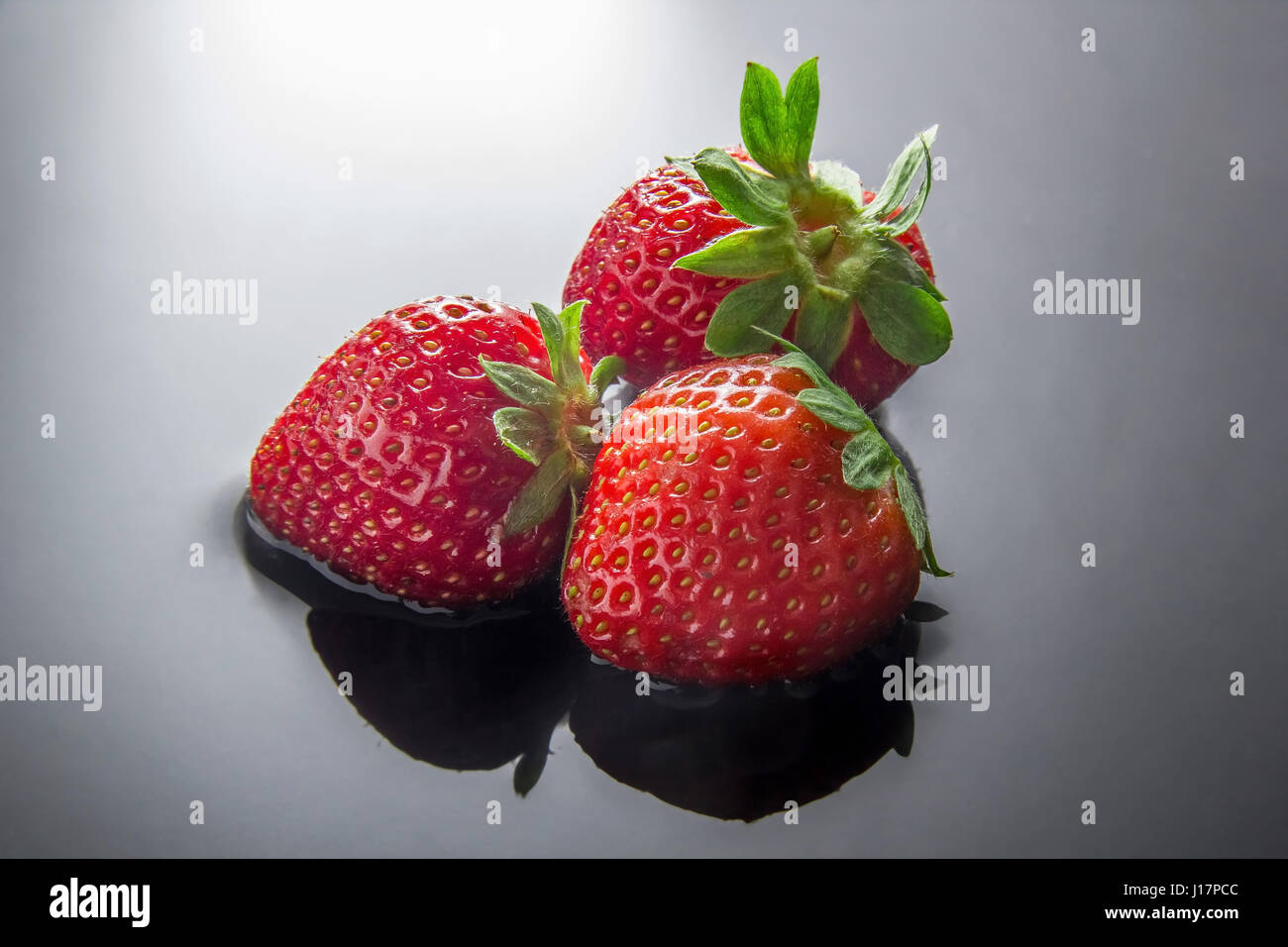 Strawberries on water Stock Photo - Alamy
