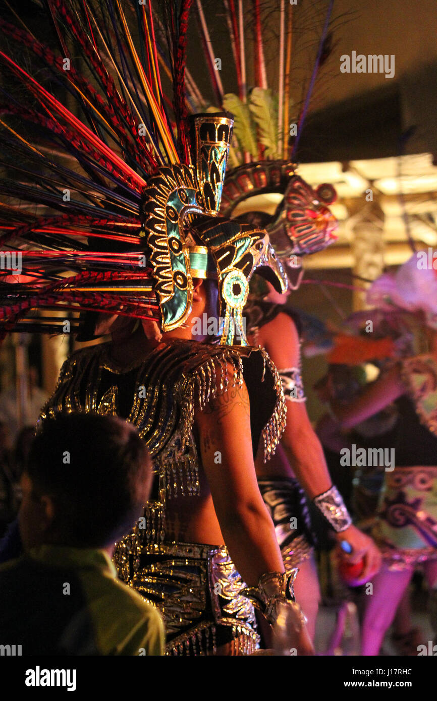 Cultural dance. Conchero Aztec dancers in elaborate costumes with brightly plumed headdresses ...