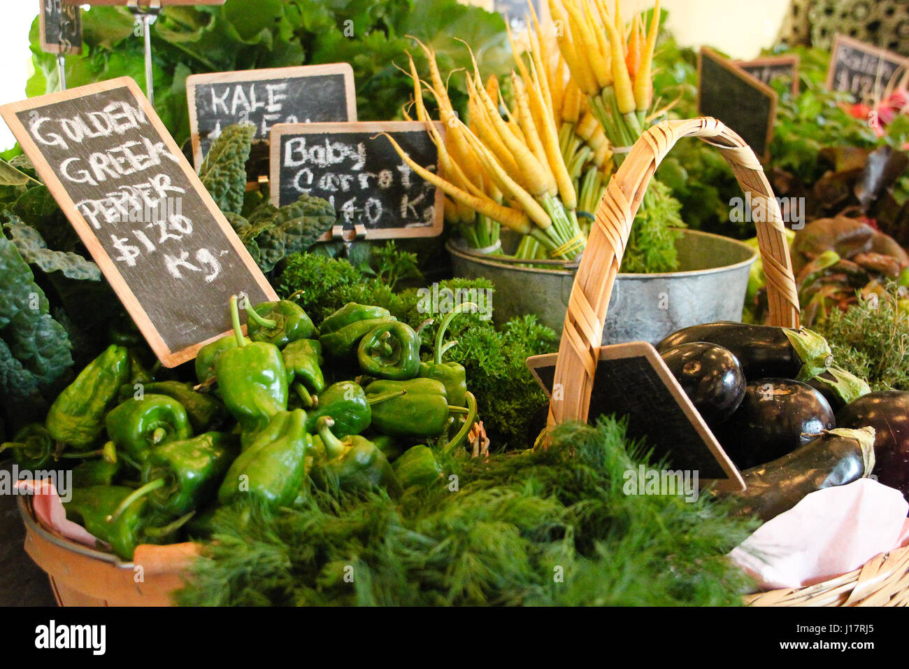 Food. Artful display of lush green organic vegetables and herbs in ...
