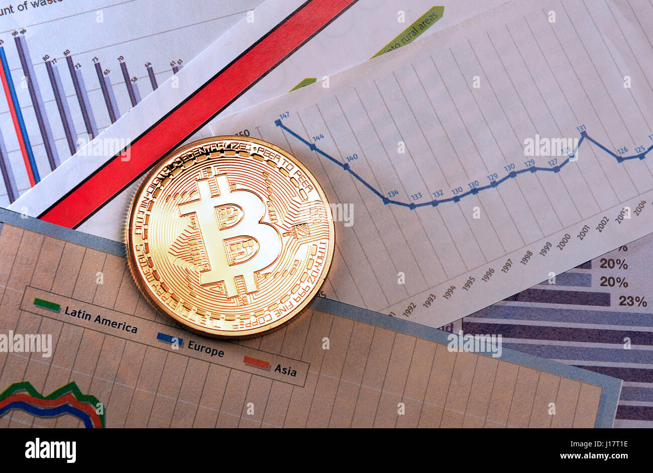 A golden bitcoin on graph and diagrams background. concept of trading ...