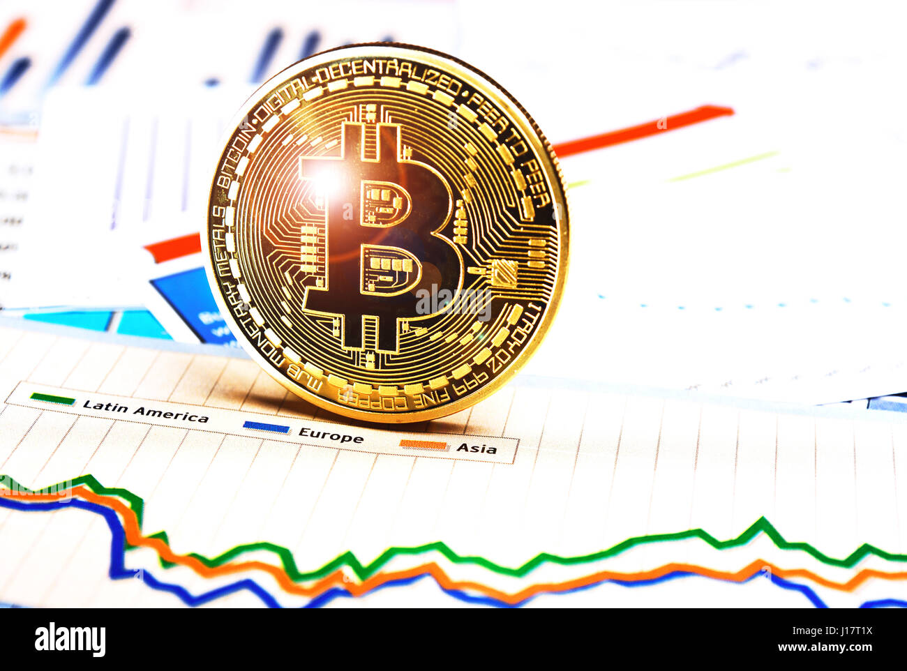 A golden bitcoin on graph and diagrams background. concept of trading ...