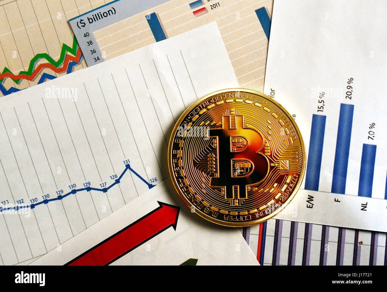 A golden bitcoin on graph and diagrams background. concept of trading ...