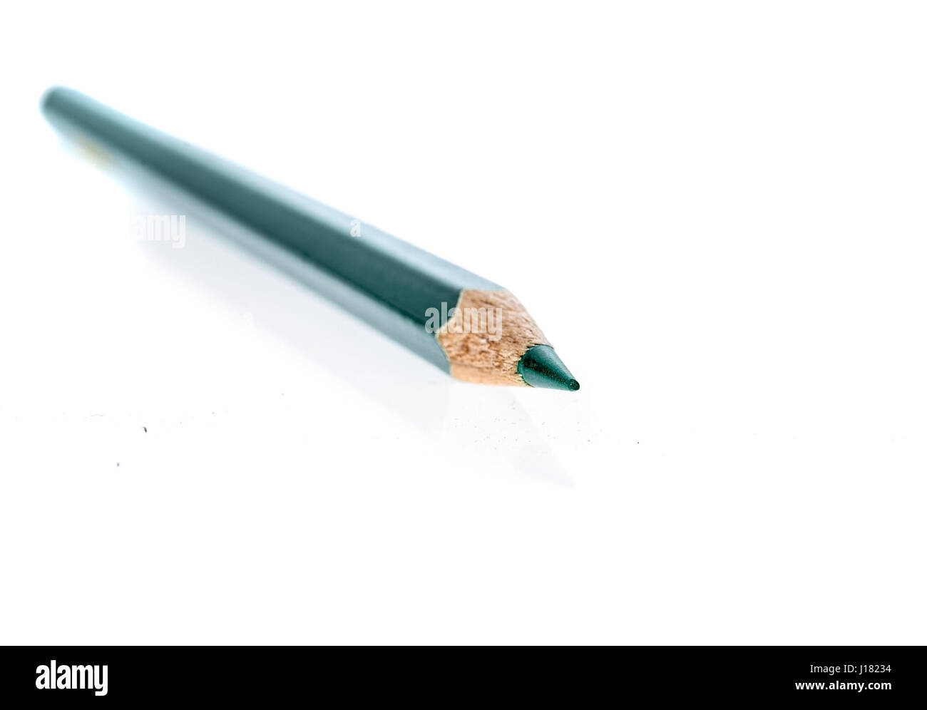 Tip of sharpened old green colour pencil isolated on white background ...