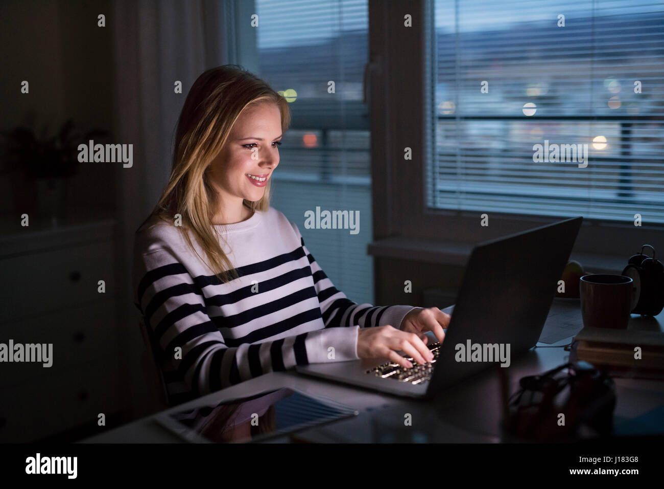 Young woman working night hi-res stock photography and images - Alamy