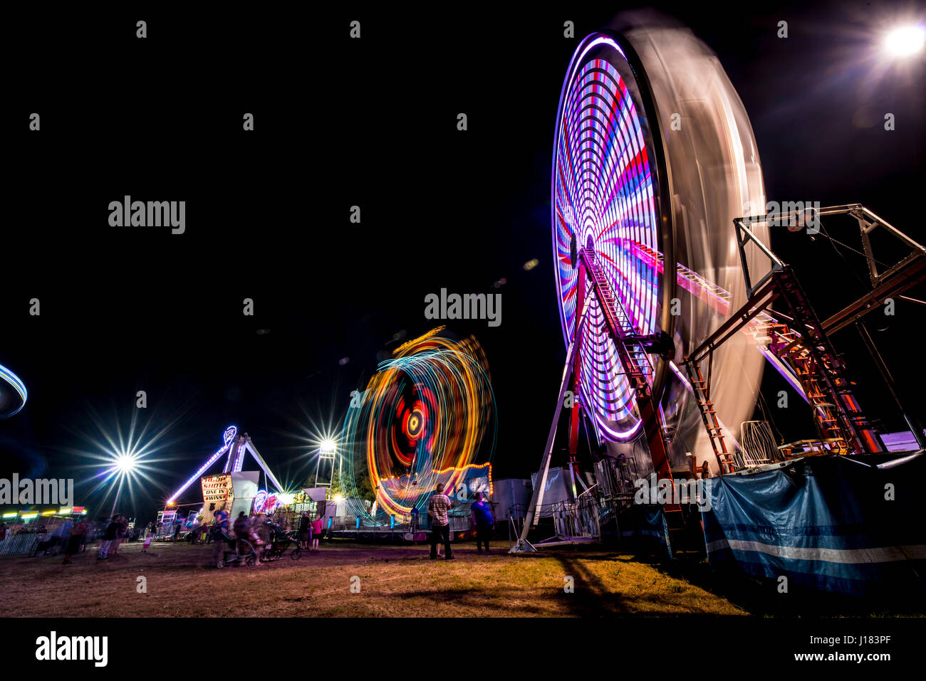 fair with farris wheel Stock Photo - Alamy